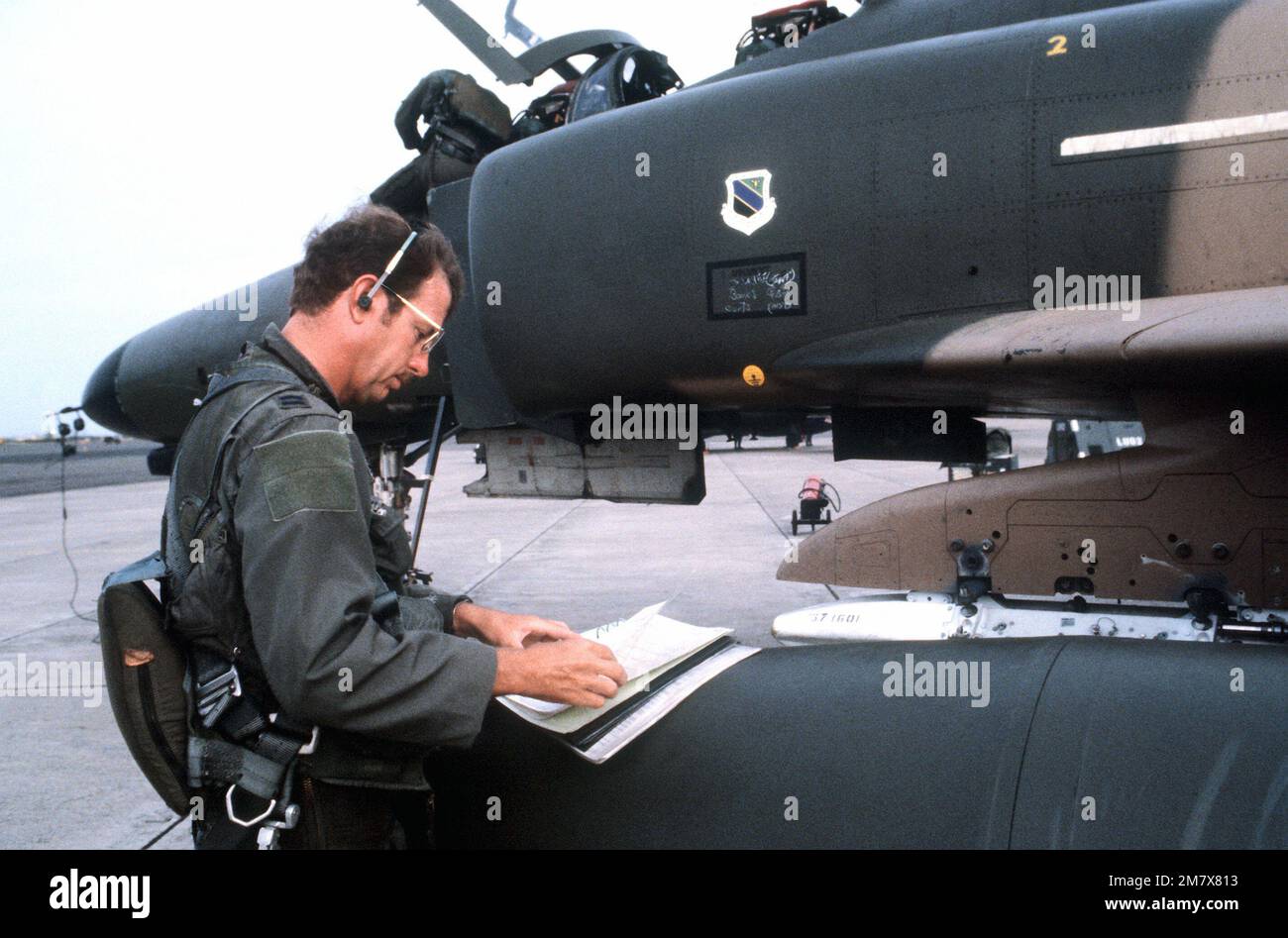 CPT Steve Sloop, a pilot making preflight inspection of his F-4 Phantom ...