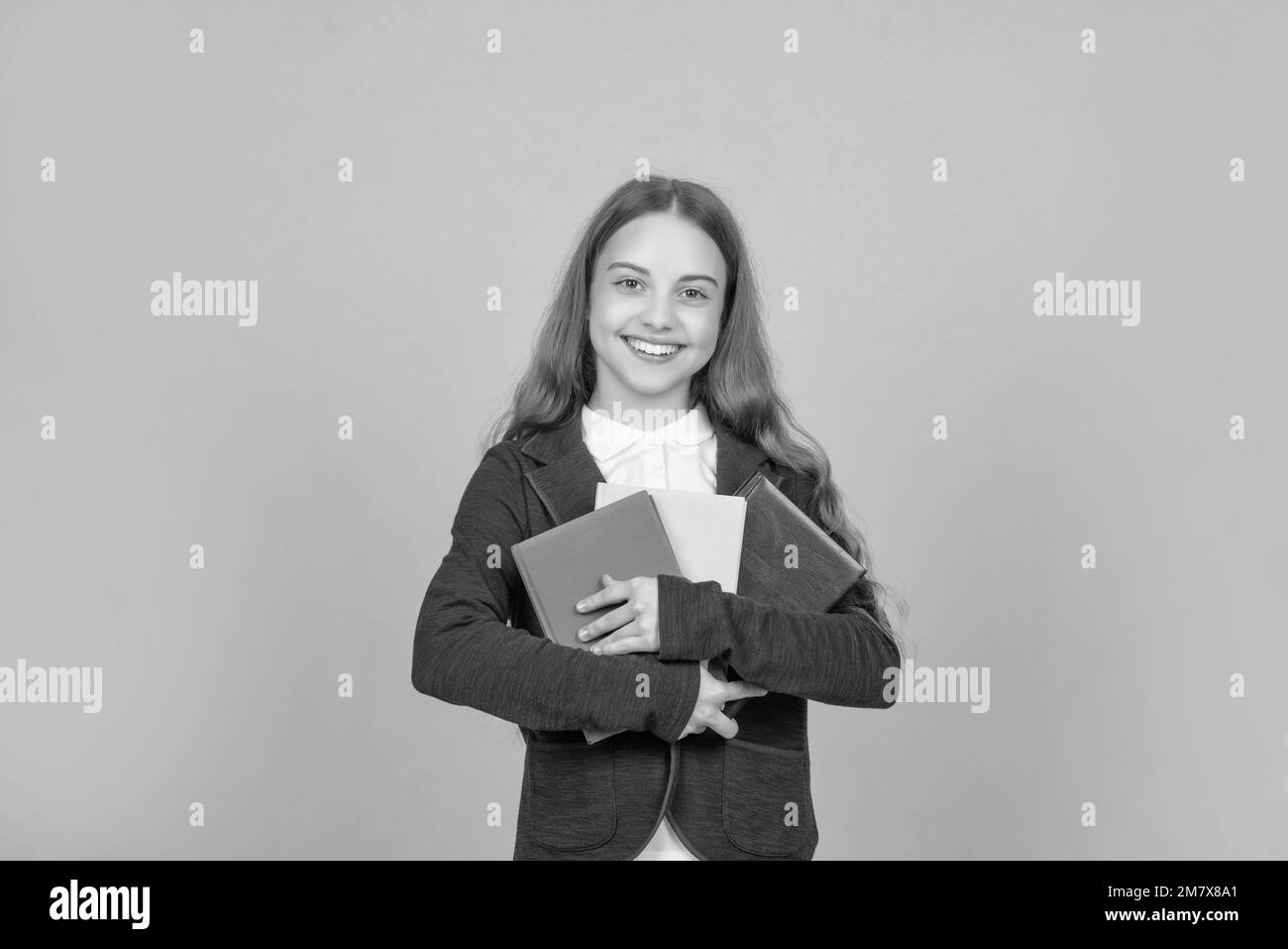 kid hold notebook. student in high school. teen girl do homework with ...