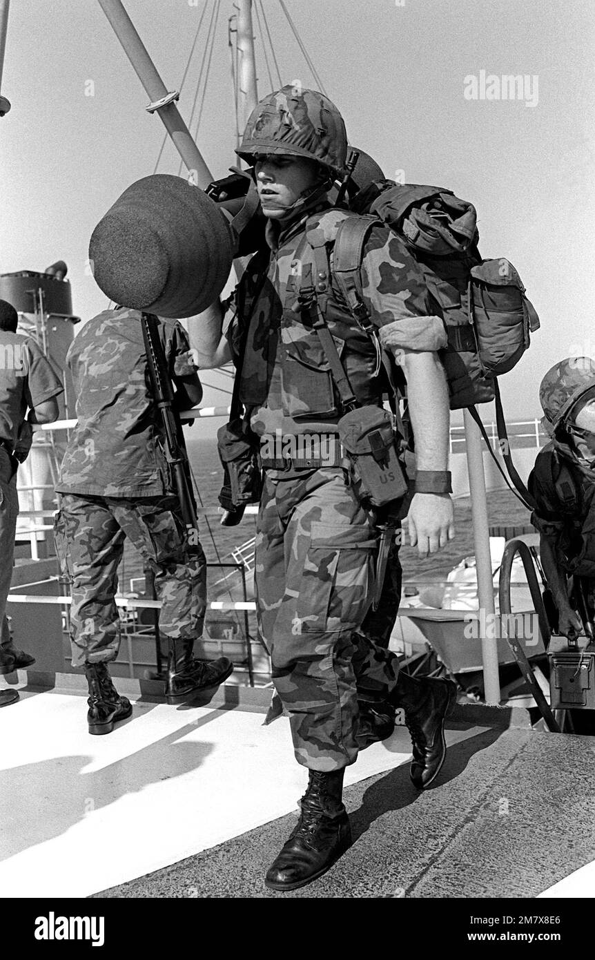 A U.S. Marine of the 32nd Marine Amphibious Unit carries his M-47 ...