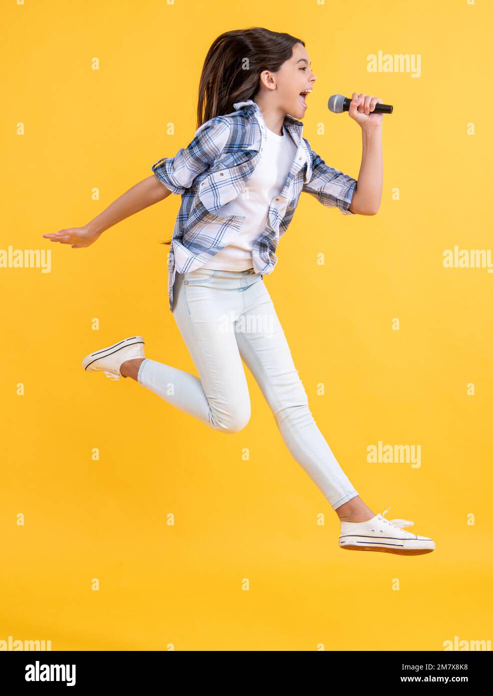 full length of teen girl karaoke singer with microphone. teen girl ...