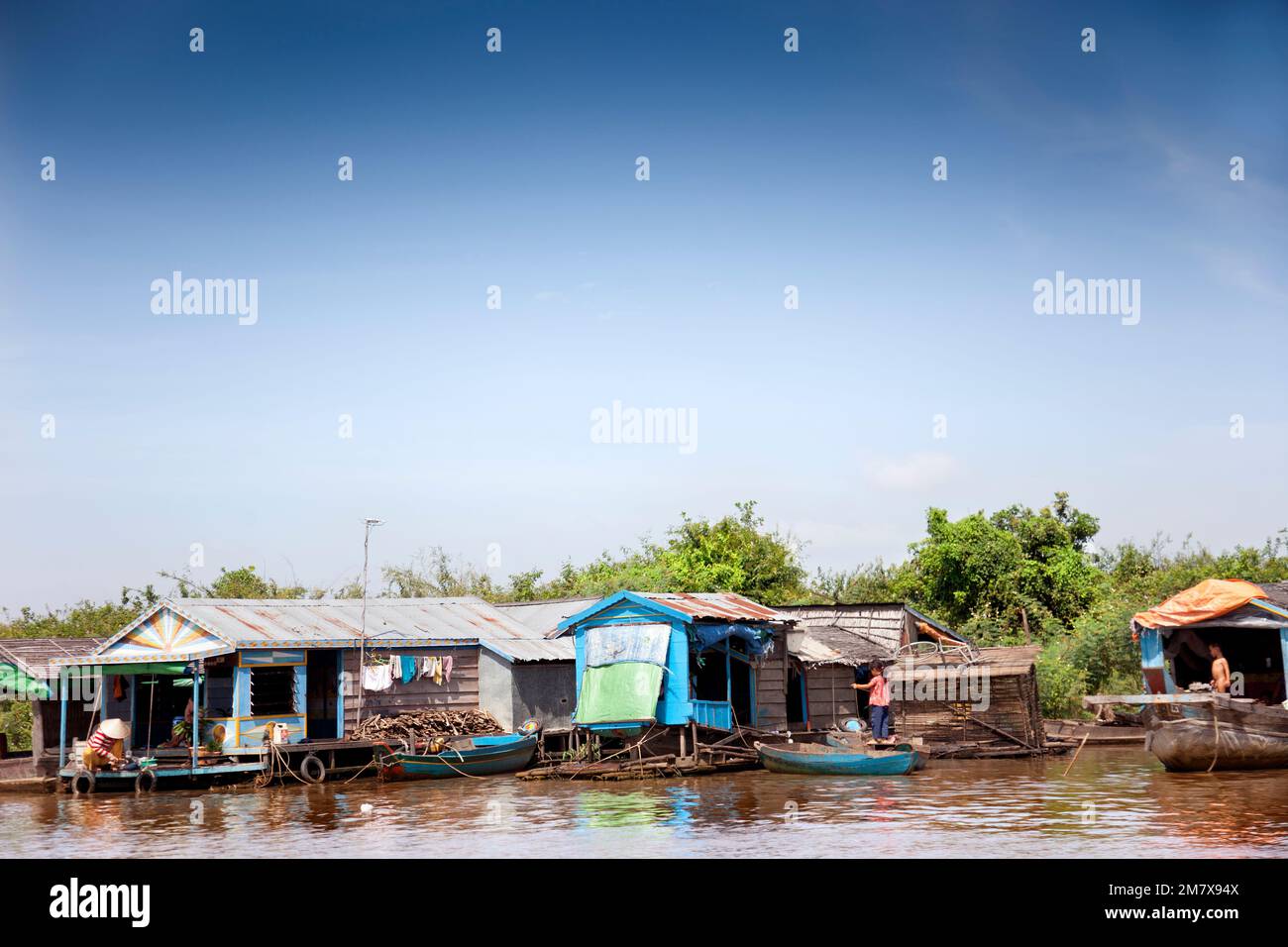 Chong Kneas, Cambodia-August 6, 2009: In a village of houseboats near ...
