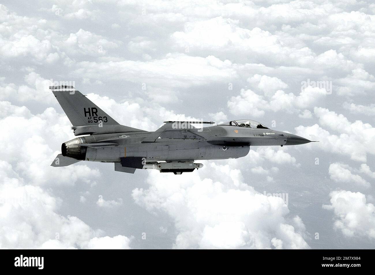 A right side view of an F-16 Fighting Falcon aircraft carrying an AN ...