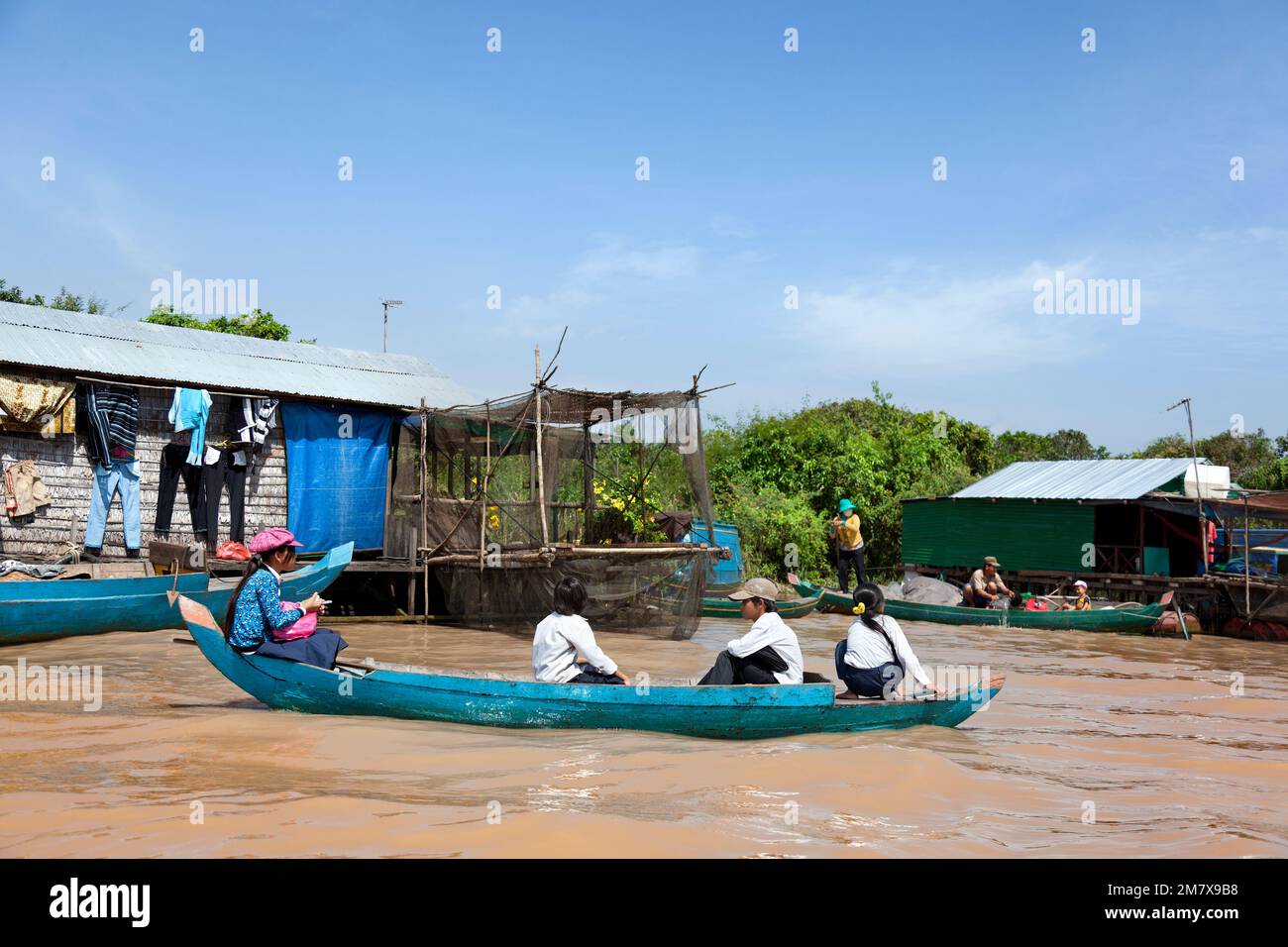 Chong Kneas, Cambodia-August 6, 2009:Kids come home from school with ...