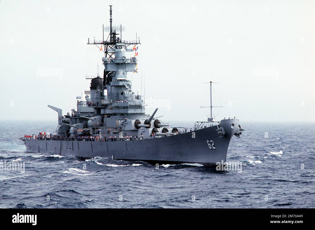 A starboard bow view of the battleship NEW JERSEY (BB-62) returning to ...