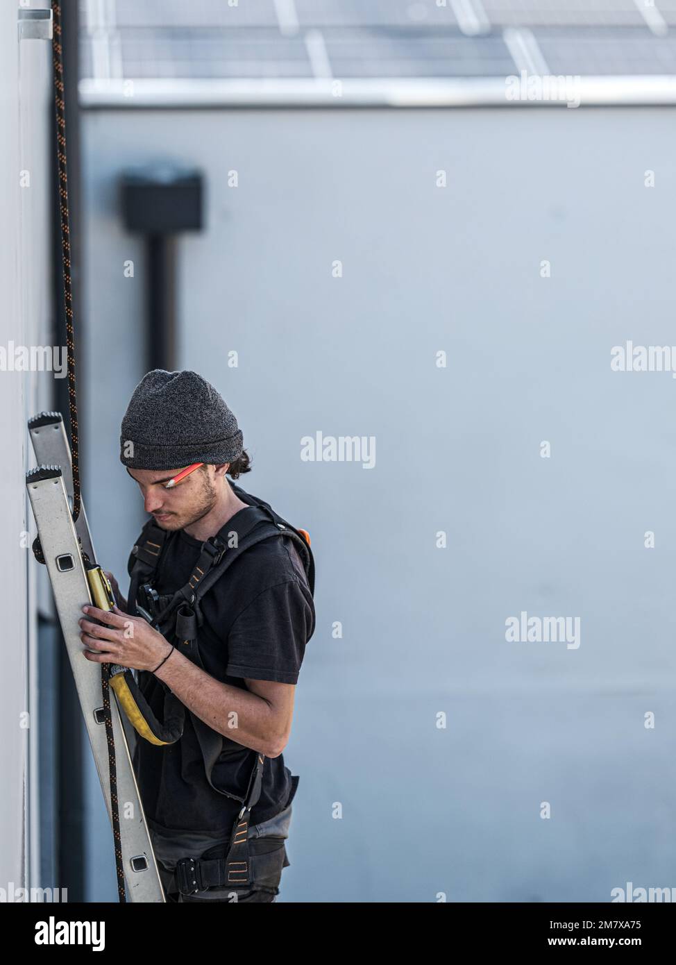 an electrical engineer of the team installs the electrical cables for ...