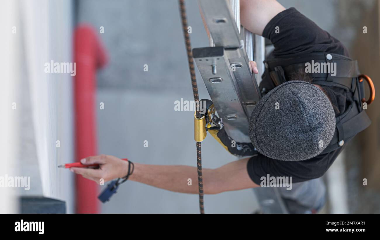 an electrical engineer of the team installs the electrical cables for ...