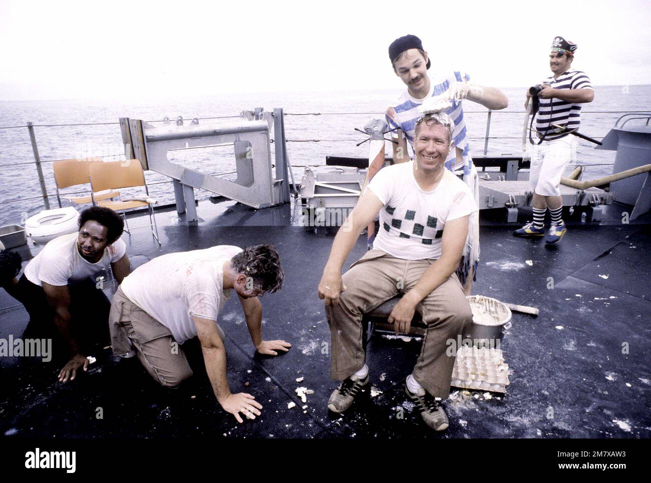 Crewmen aboard the destroyer USS ARTHUR W. RADFORD (DD-968) participate ...