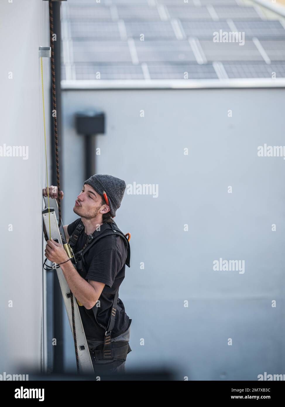 an electrical engineer of the team installs the electrical cables for ...