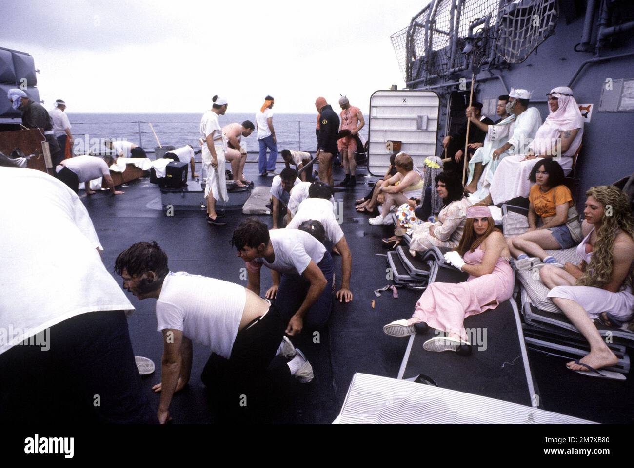 Crewmen aboard the destroyer USS ARTHUR W. RADFORD (DD-968) participate ...