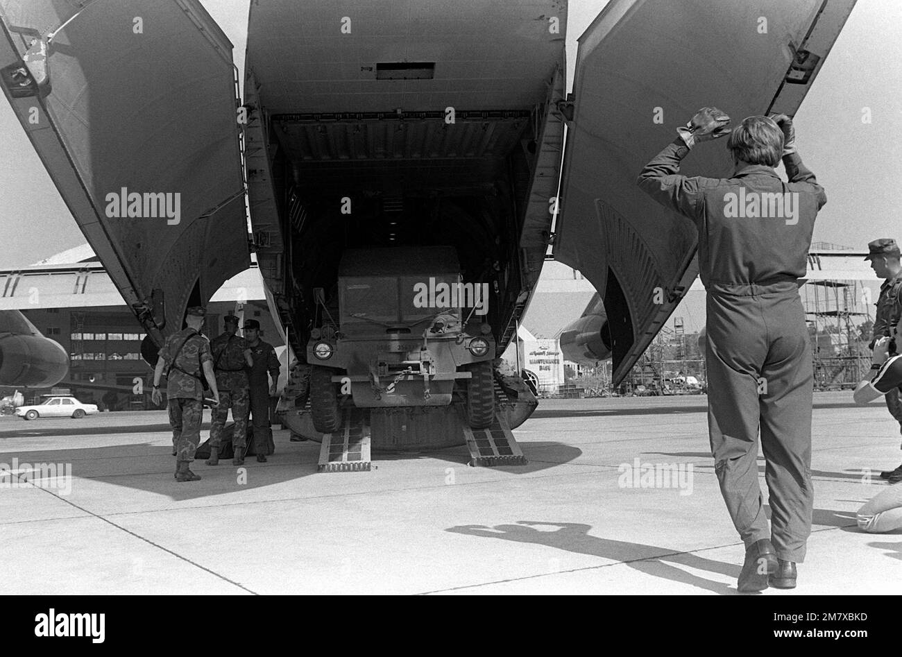 U. S. Marine equipment is offloaded from a C-141B Starlifter aircraft ...