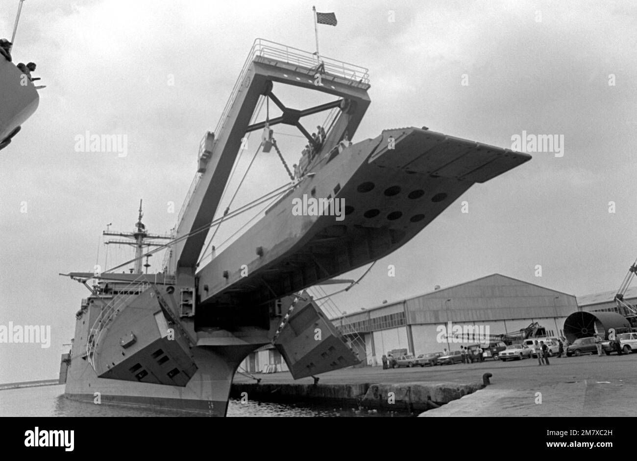 A view of the tank landing ship USS SAGINAW (LST-1188) lowering its ...