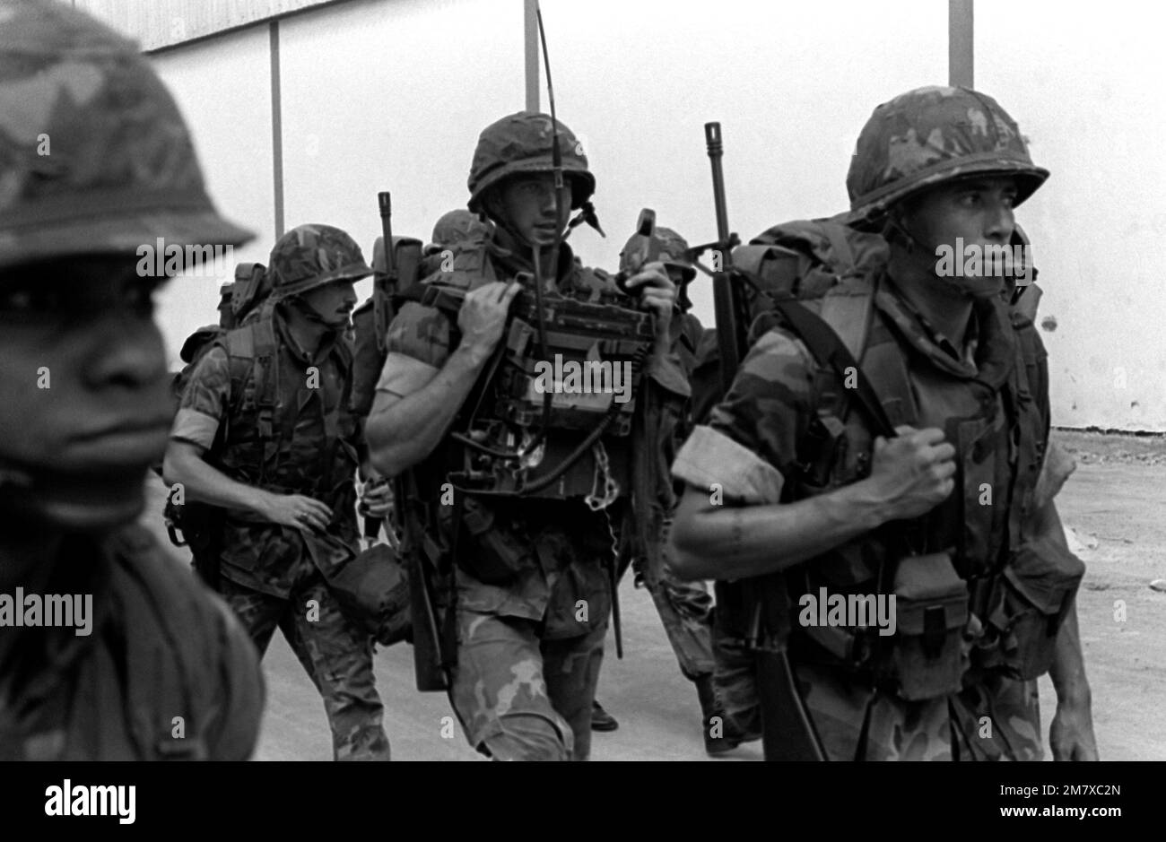 Marines from the 32nd Marine Amphibious Unit walk toward their quarters ...