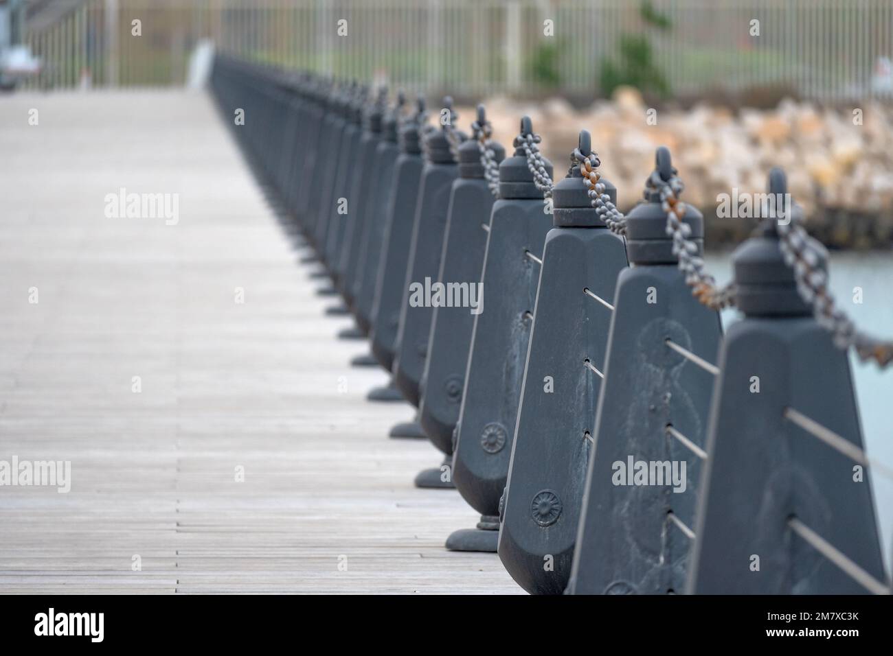 Wooden chain pillar on dock. Fencing Chain wall. Selective Focus Stock ...