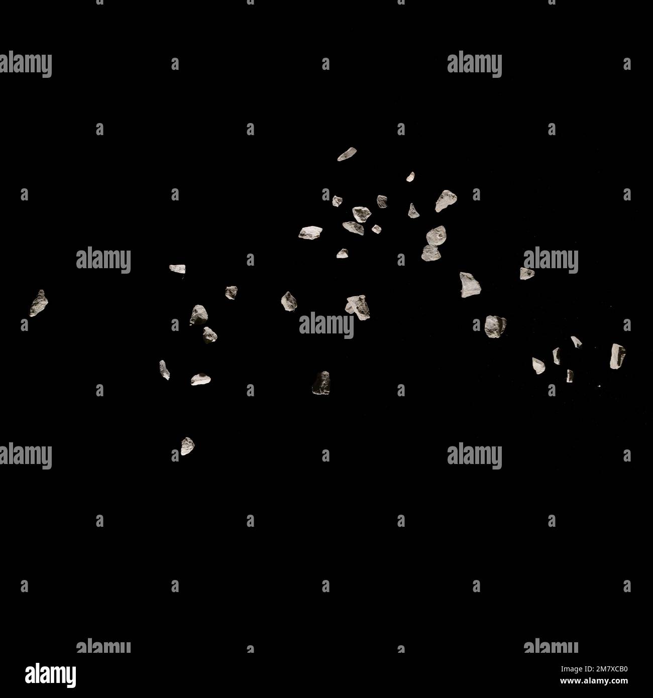 Mixed stone explosion on black background Stock Photo - Alamy