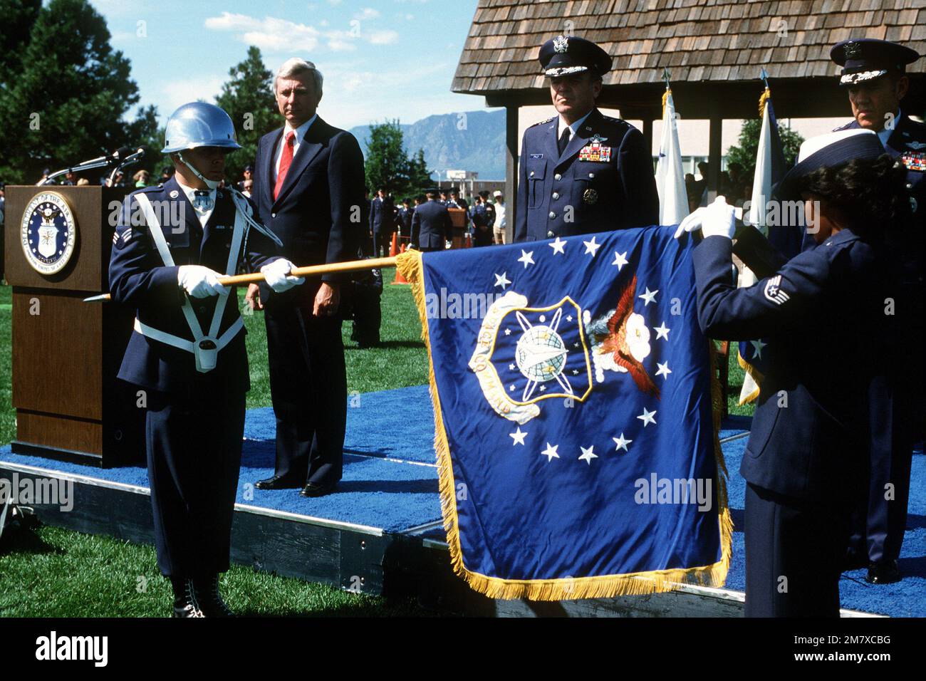 Standing at attention during the presentation to the Color Guard of the ...