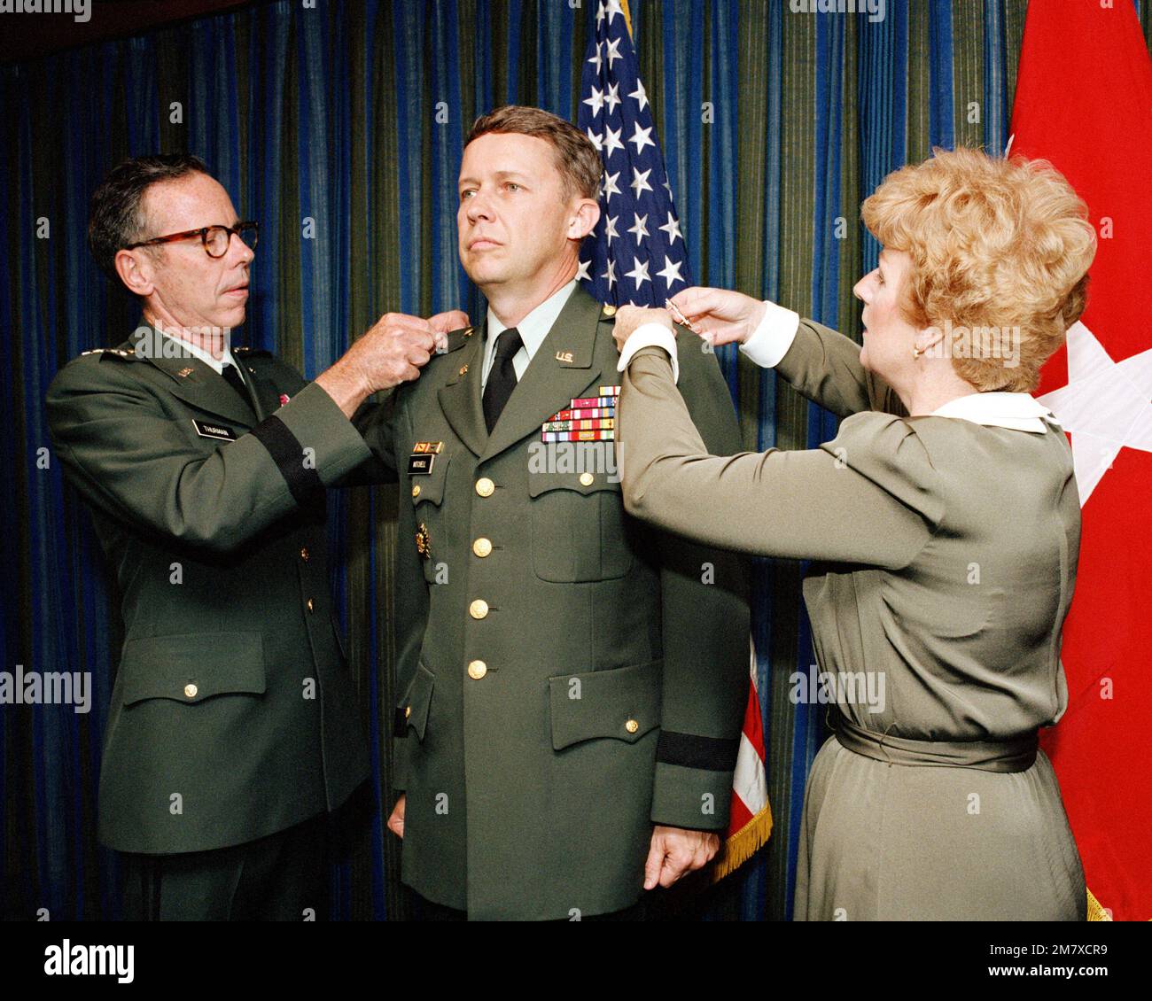 LGEN M.R. Thurman, deputy chief of staff for personnel, pins the stars ...