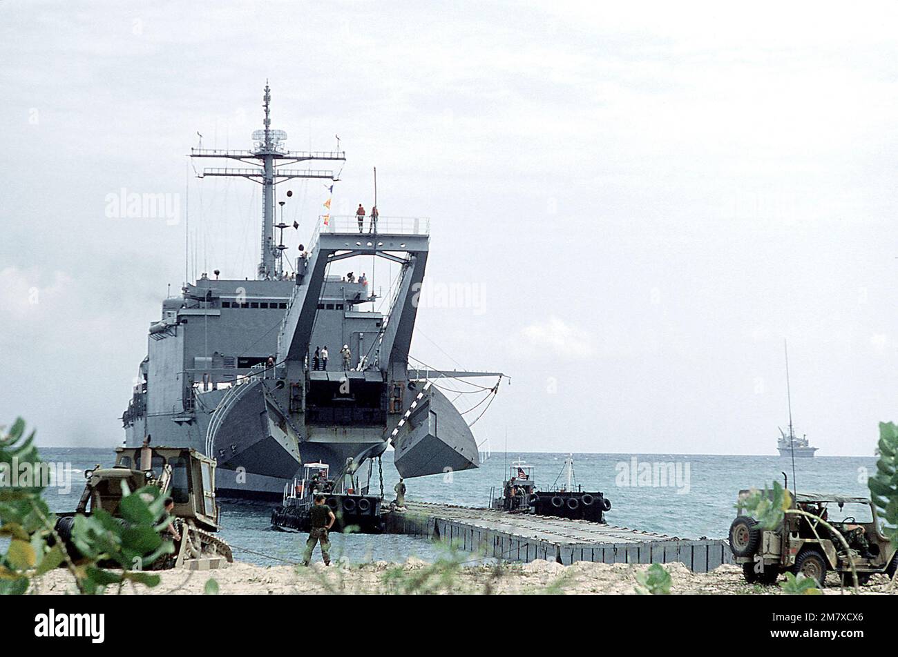 A port bow view of a tank landing ship (LST), with open bulwarks for ...