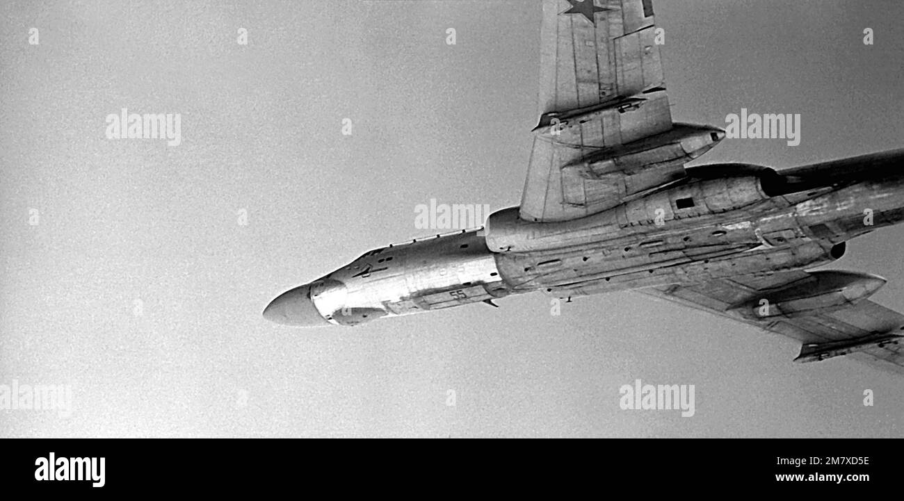 An underside view of a Soviet Tu-16 Badger reconnaissance aircraft ...
