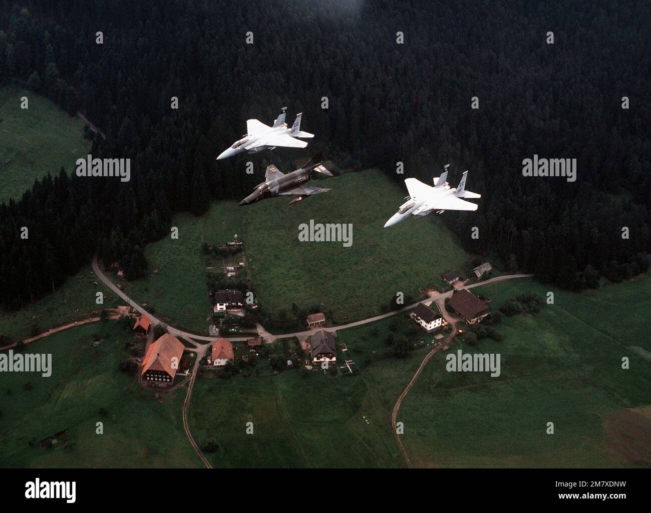 An air-to-air view of a German RF-4 Phantom II aircraft and two F-15 ...