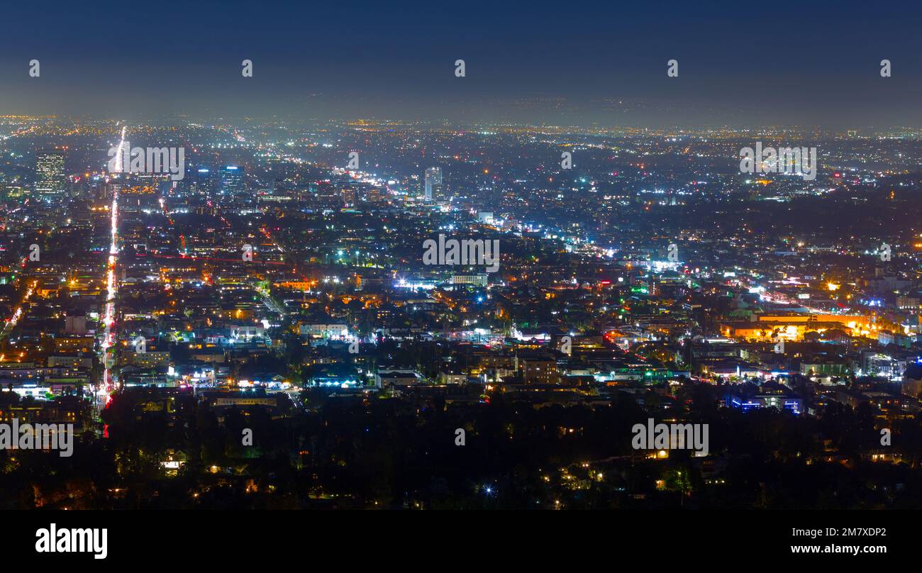 An aerial night view of L.A. showing the grid road system in Los ...