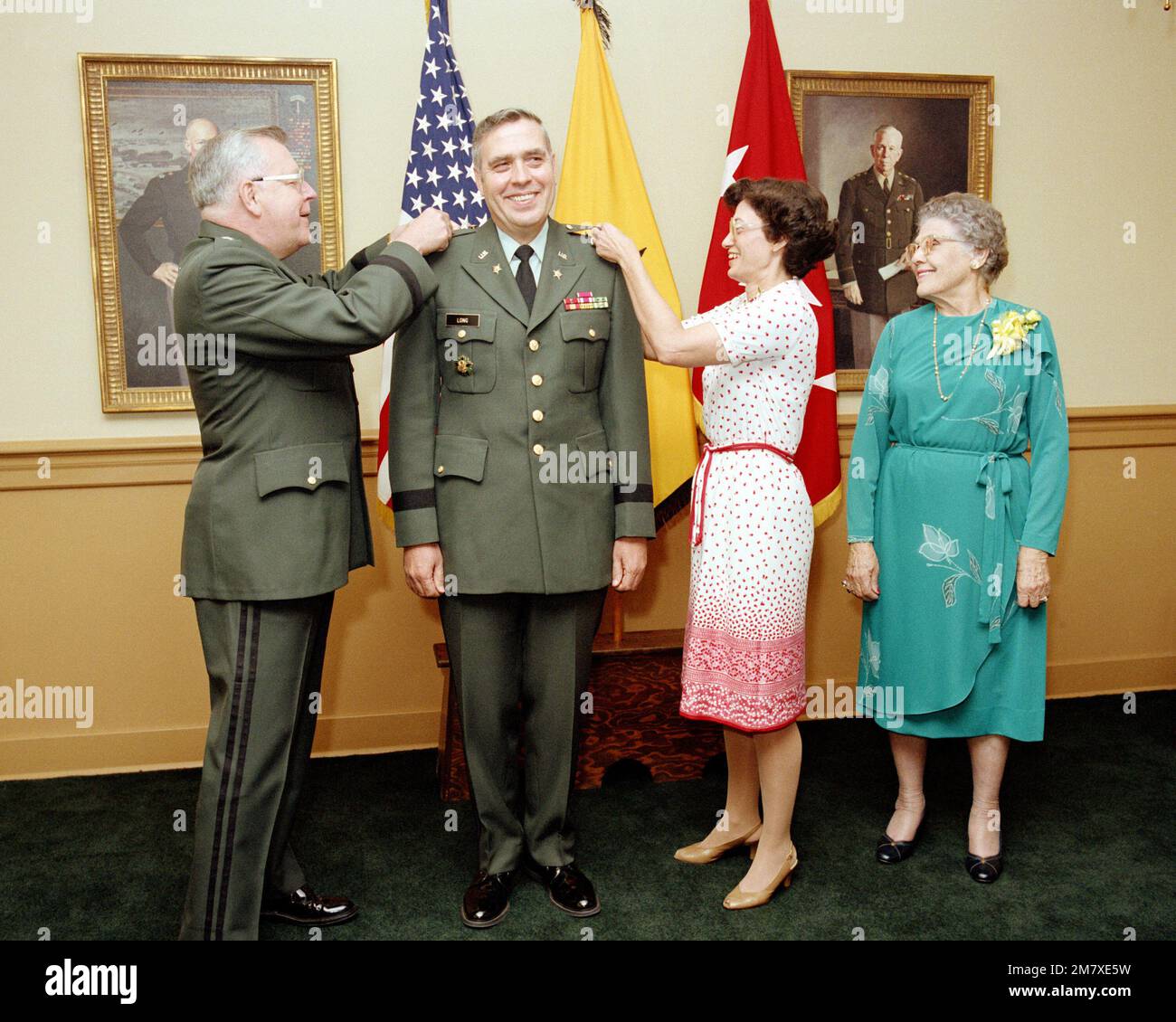 Upon his promotion to BGEN John E. Long receives his star from LGEN ...