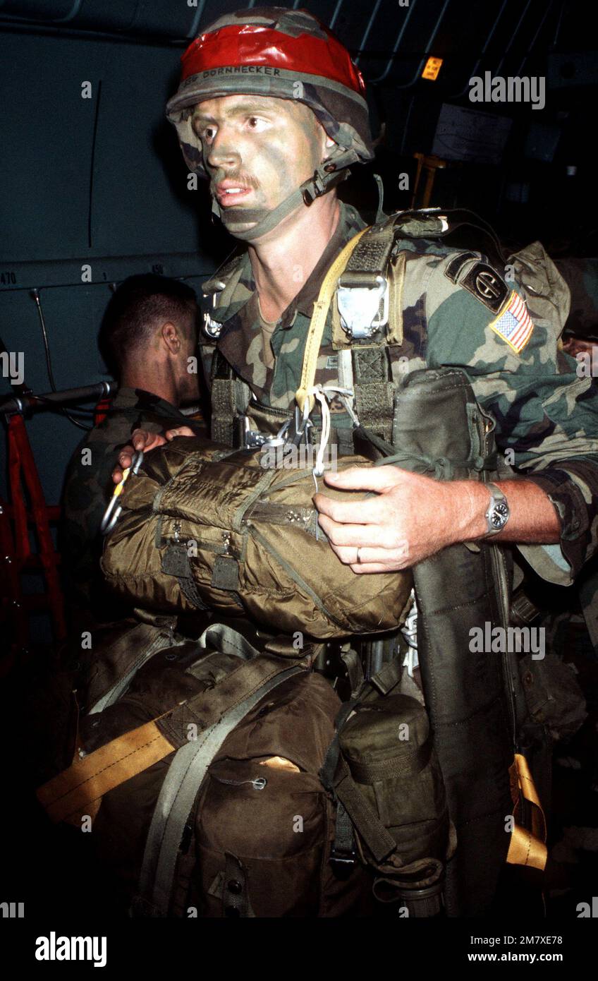 A member of the 82nd Airborne Division, aboard a C-141 Starlifter ...