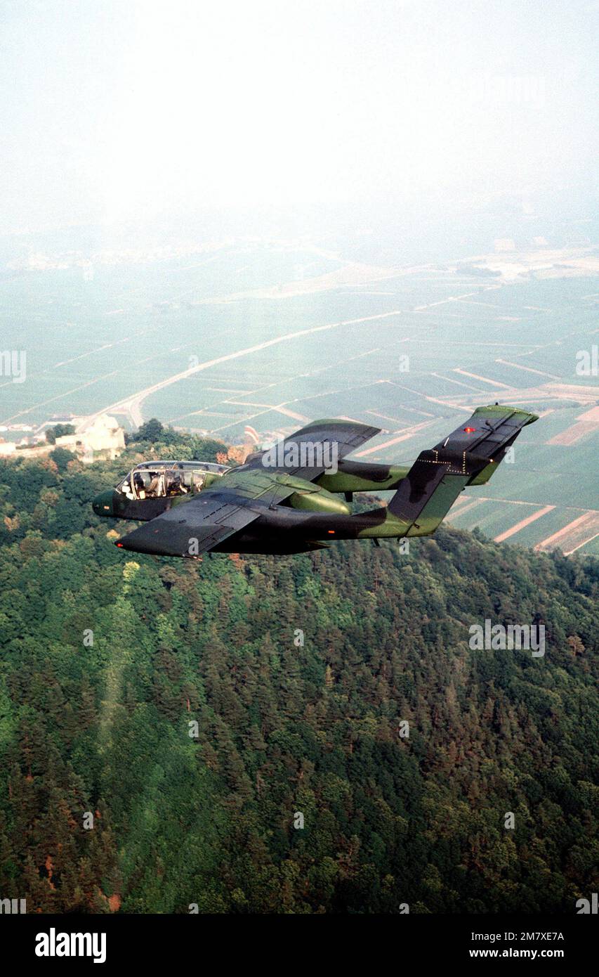 An air-to-air left side view of an OV-10 Bronco aircraft in use during ...