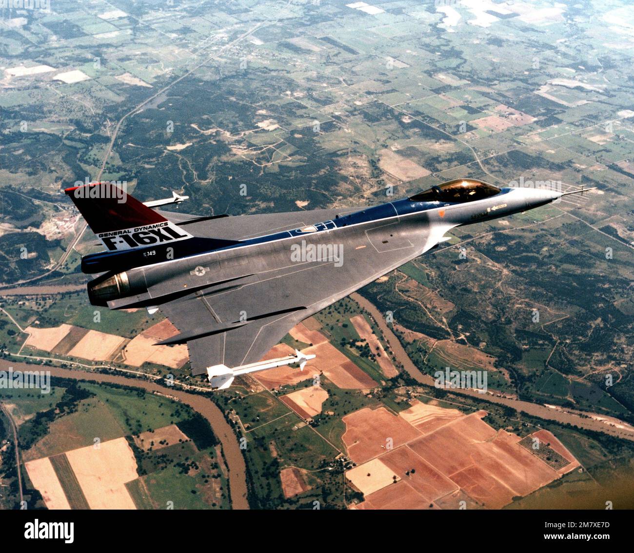 An air-to-air right side view of the F-16X Fighting Falcon prototype ...