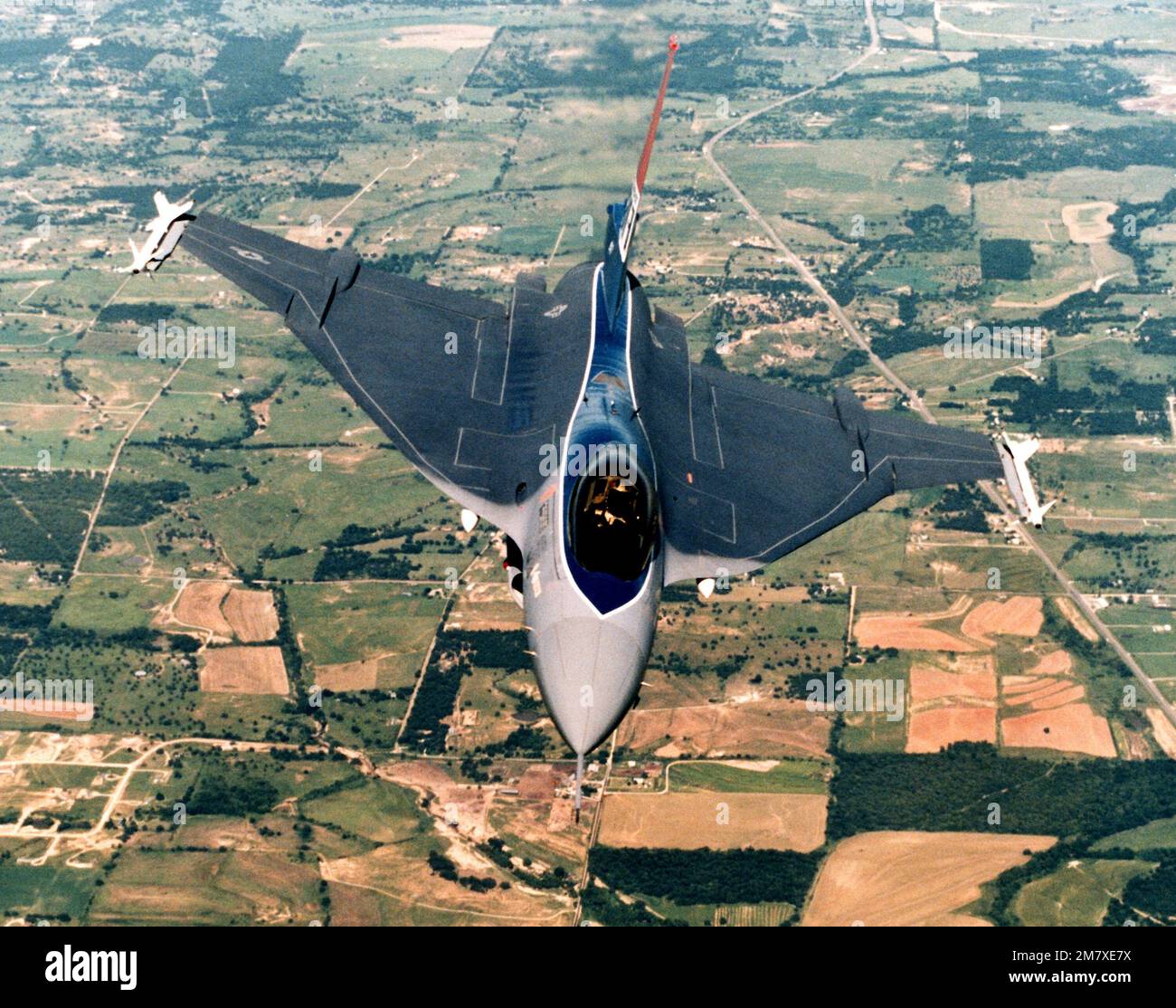 An air-to-air top front view of an F-16XL Fighting Falcon prototype ...