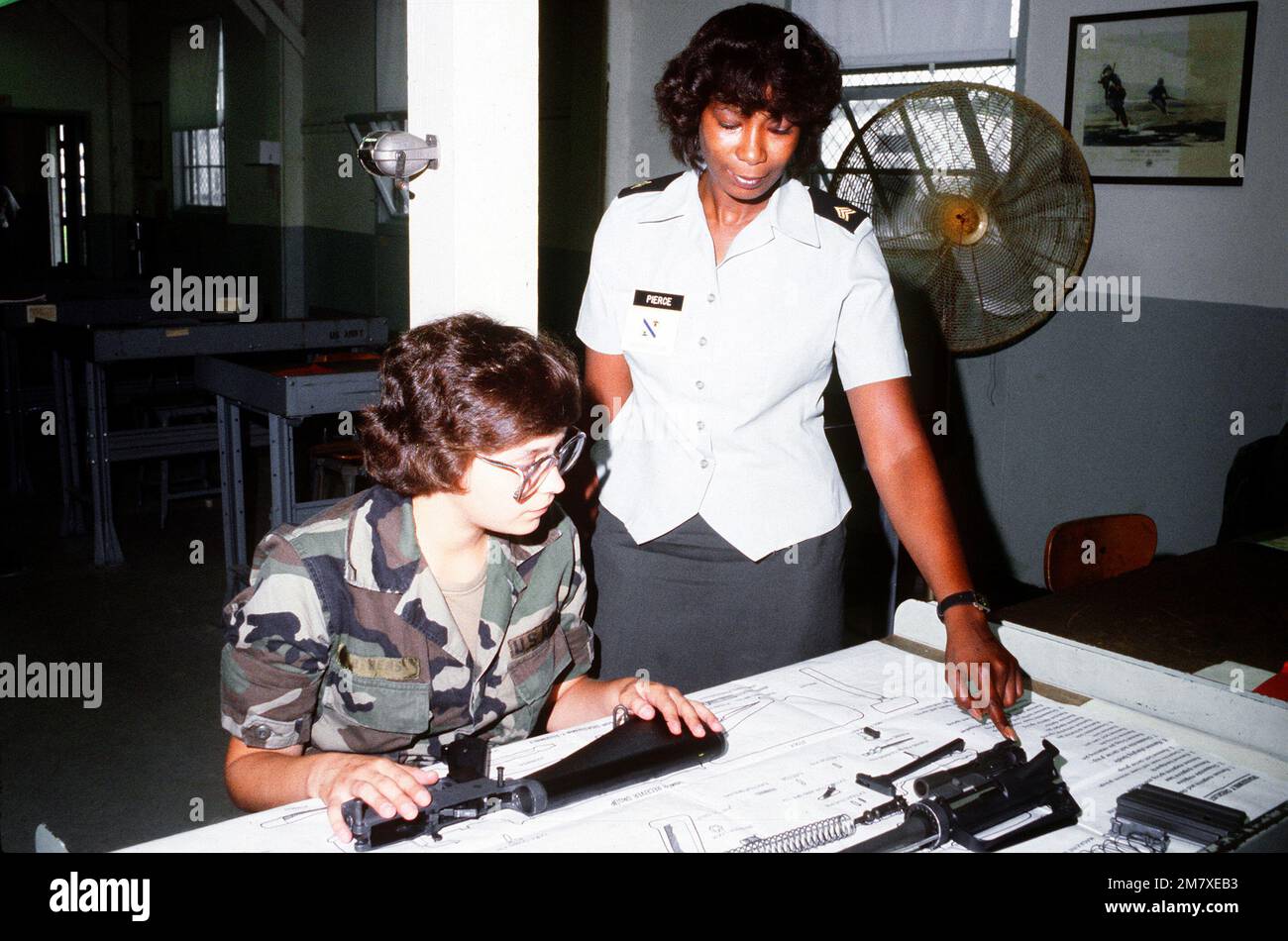 SGT. Bunda Pierce, instructor, and PVT. Debbie Berens discuss the ...