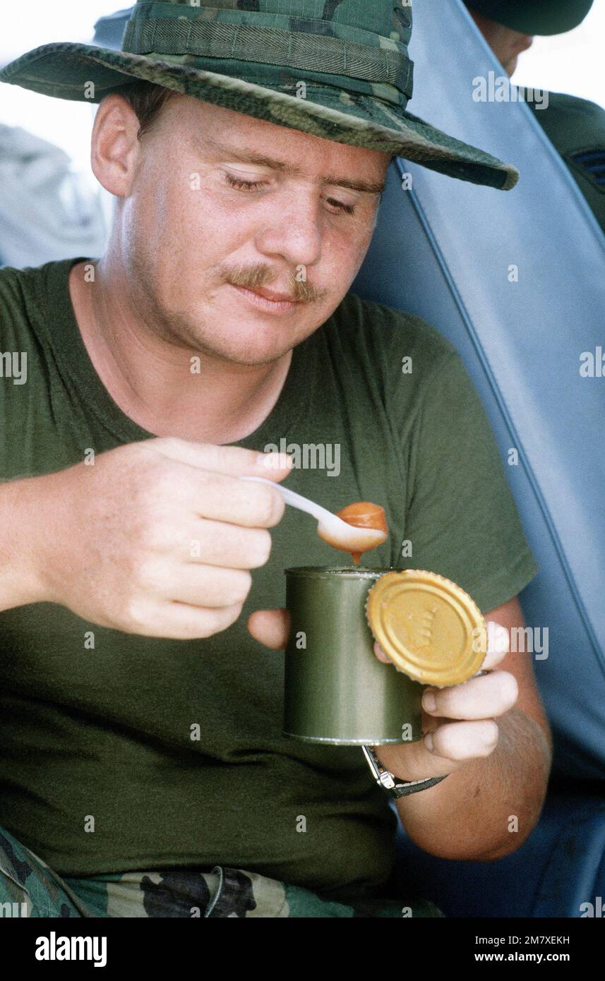 SSGT Jeffrey L. Robbins of the 374th Aerial Port Squadron, dines on a ...