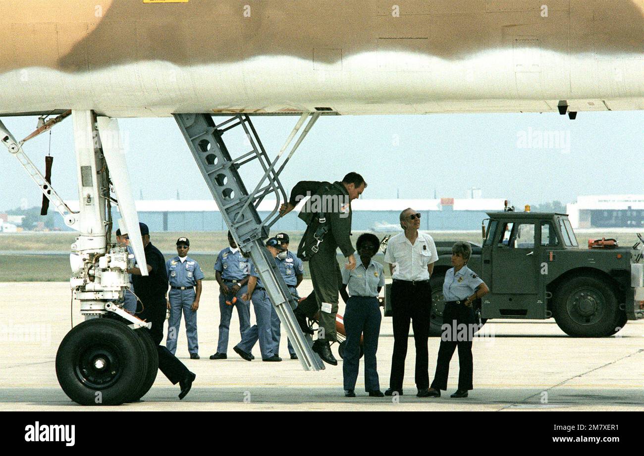 Rockwell test pilot Doug Benefield steps down the exit ladder of a B-1 ...