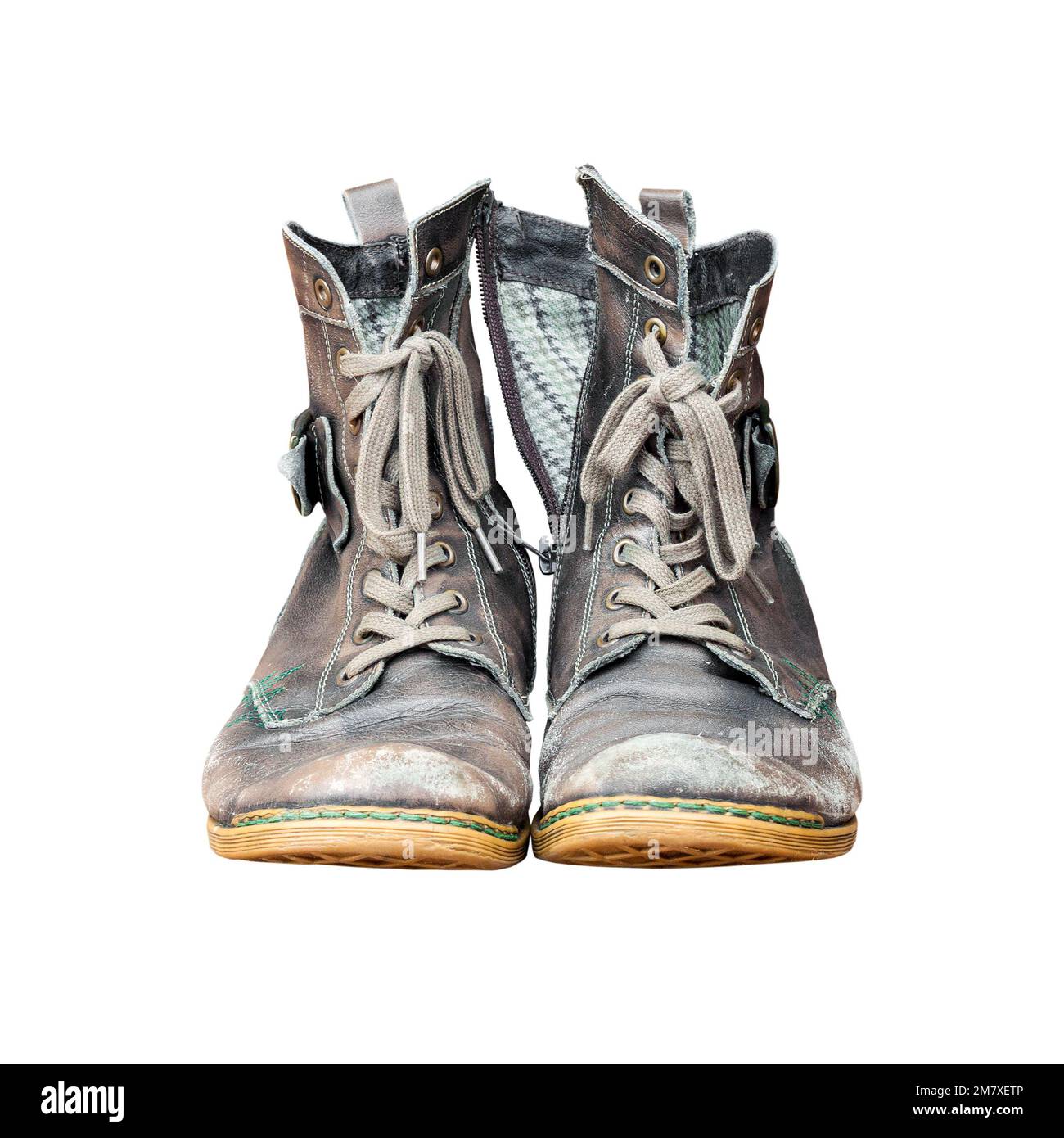 Pair of old worn out leather boots isolated, front view footwear cutout ...