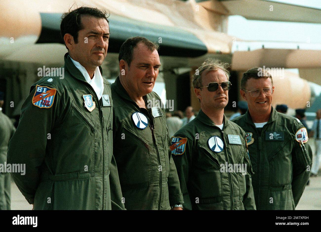 Members of the B-1 bomber aircraft test team post in front of the B-1 ...