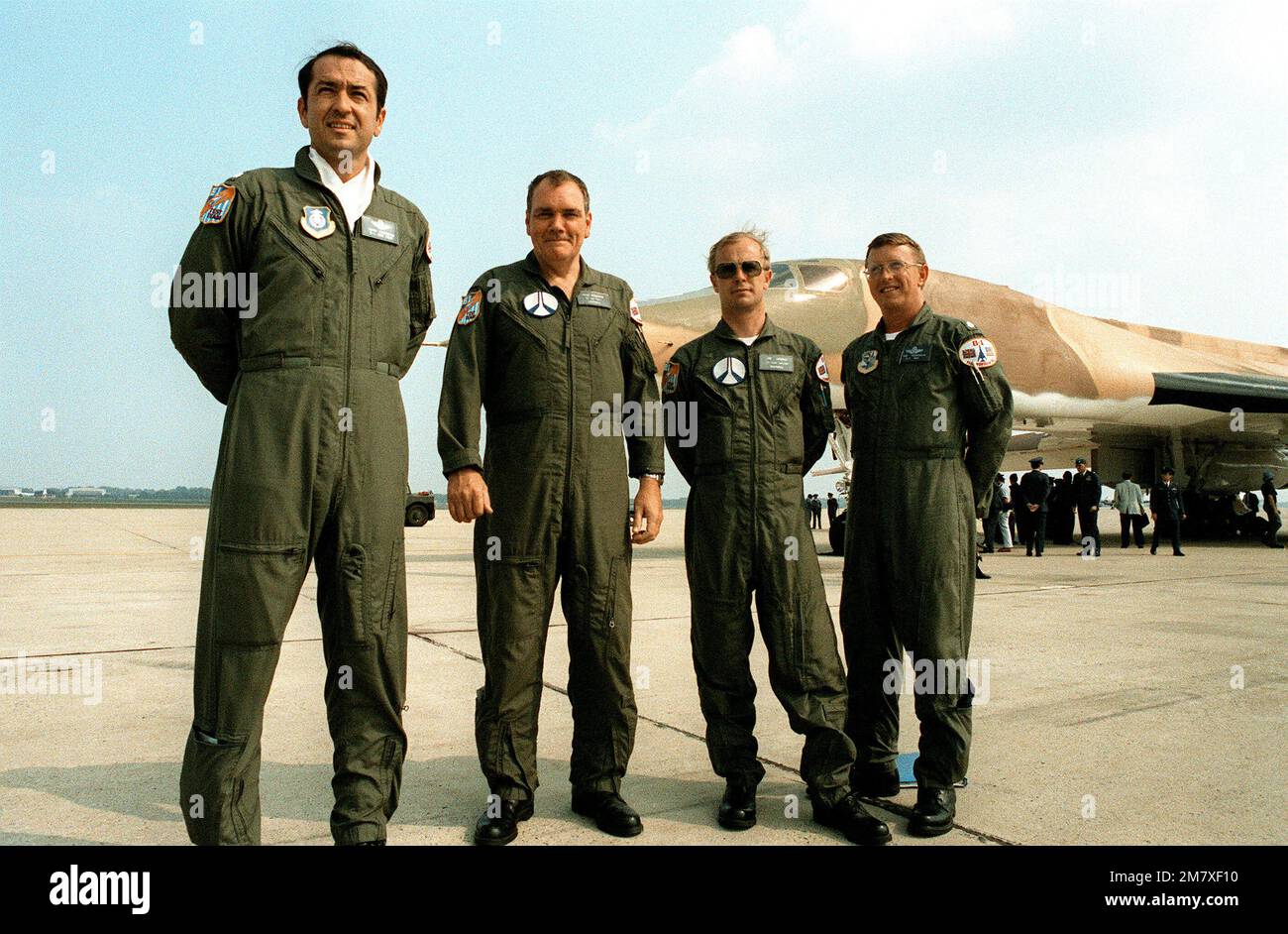 Members of the B-1 bomber aircraft test team pose in front of the B-1 ...