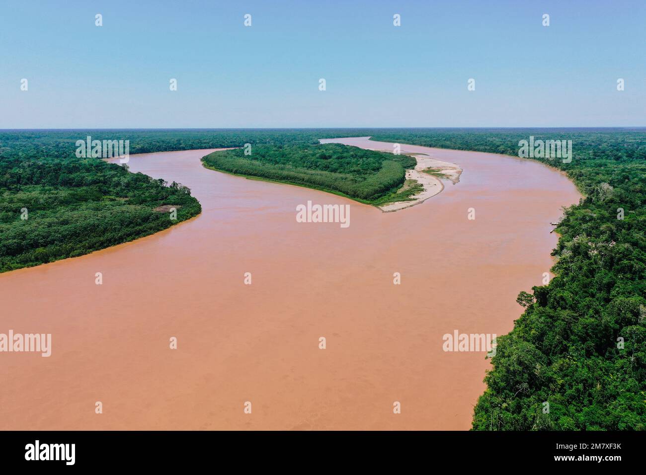 A beautiful natural view of the Amazon river in pink color between the ...