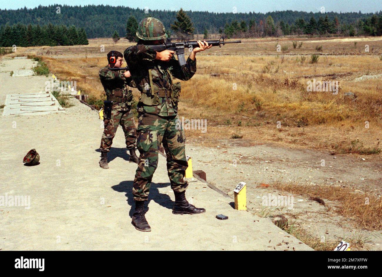 A member of the 2nd Battalion, 25th Infantry, 9th Division, fires an ...