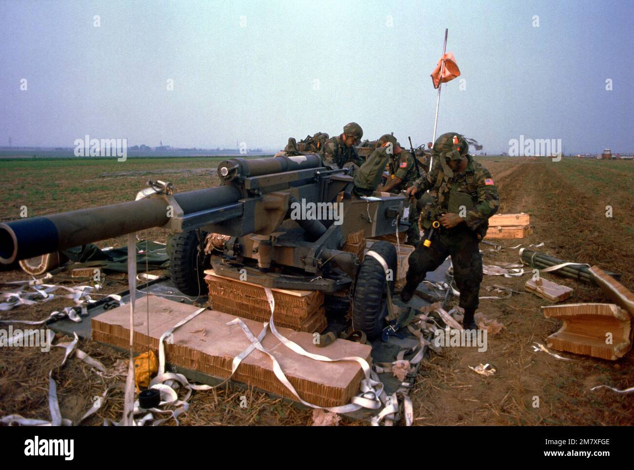 Members of the 82nd Airborne Division recover a 105mm howitzer after an ...