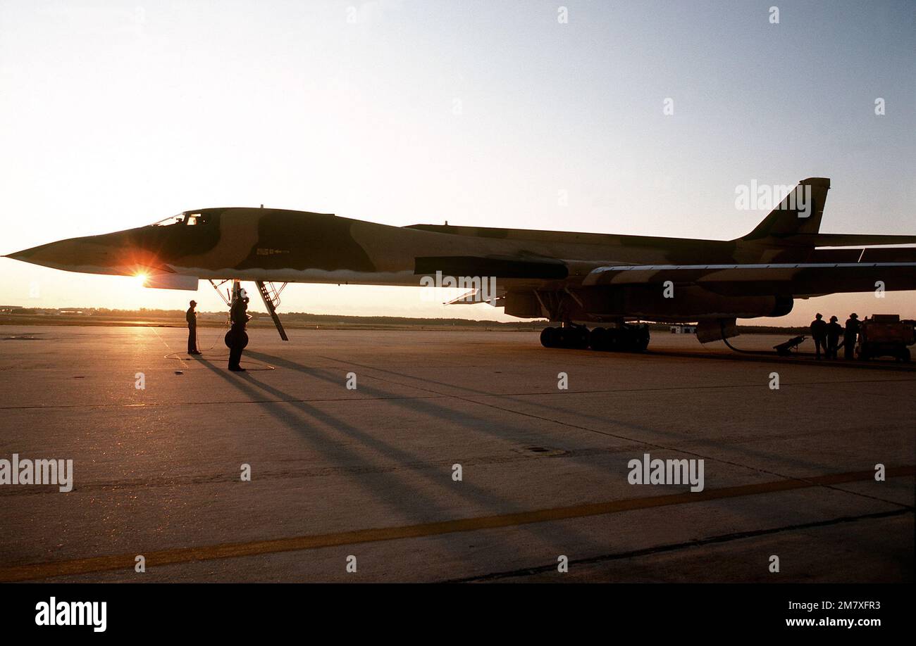 A silhouetted left side view of the front section of a B-1 bomber ...