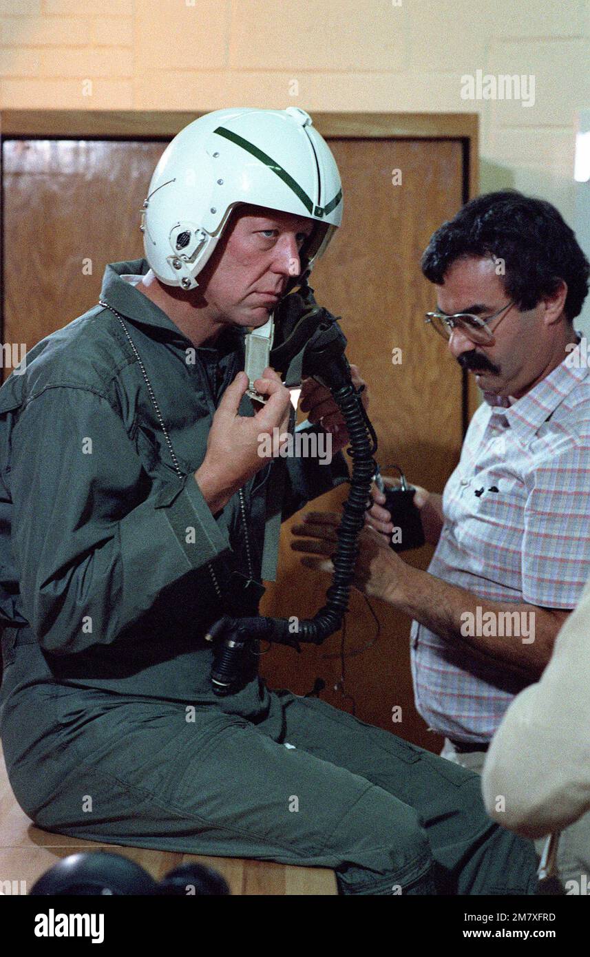 Newsman David Hartman is assisted with his equipment prior to entering ...