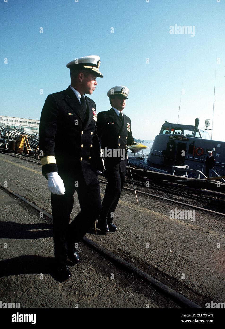 A flag officer arrives to participate in the commissioning ceremony for ...