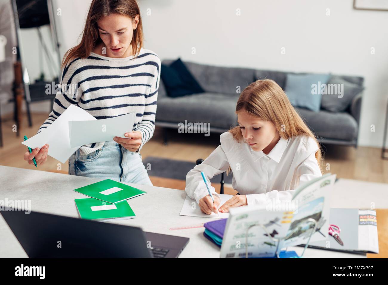 Mother helps her daughter with her homework Stock Photo - Alamy Mother helps her daughter with her homework Stock Photo - Alamy