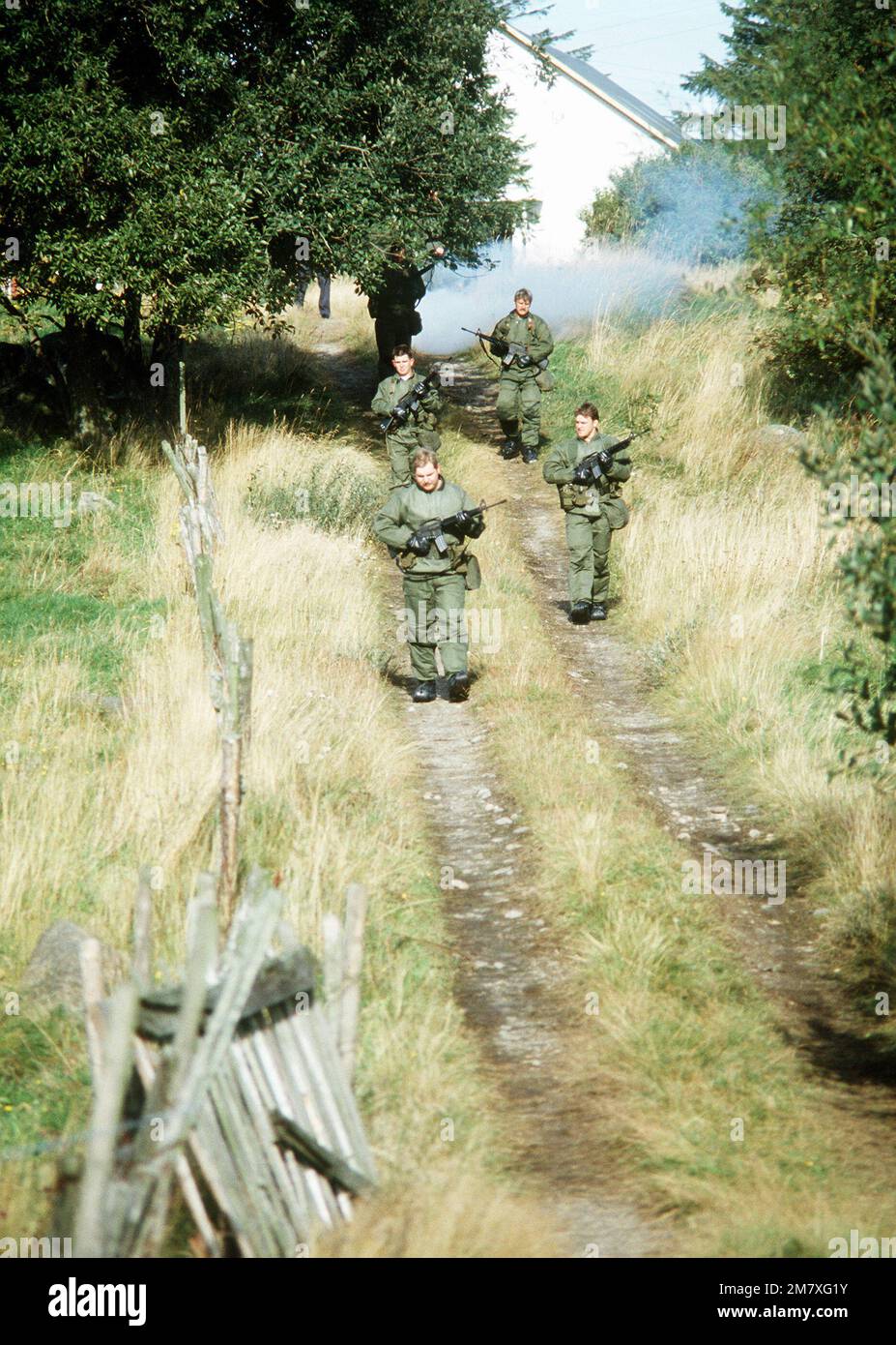 Security police and disaster preparedness personnel participate in a ...