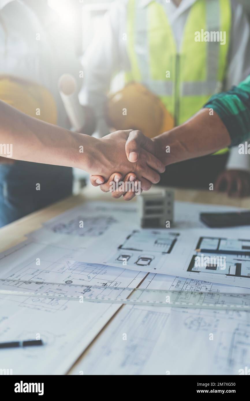 Architect people working with blueprints. Civil engineer teams meeting ...