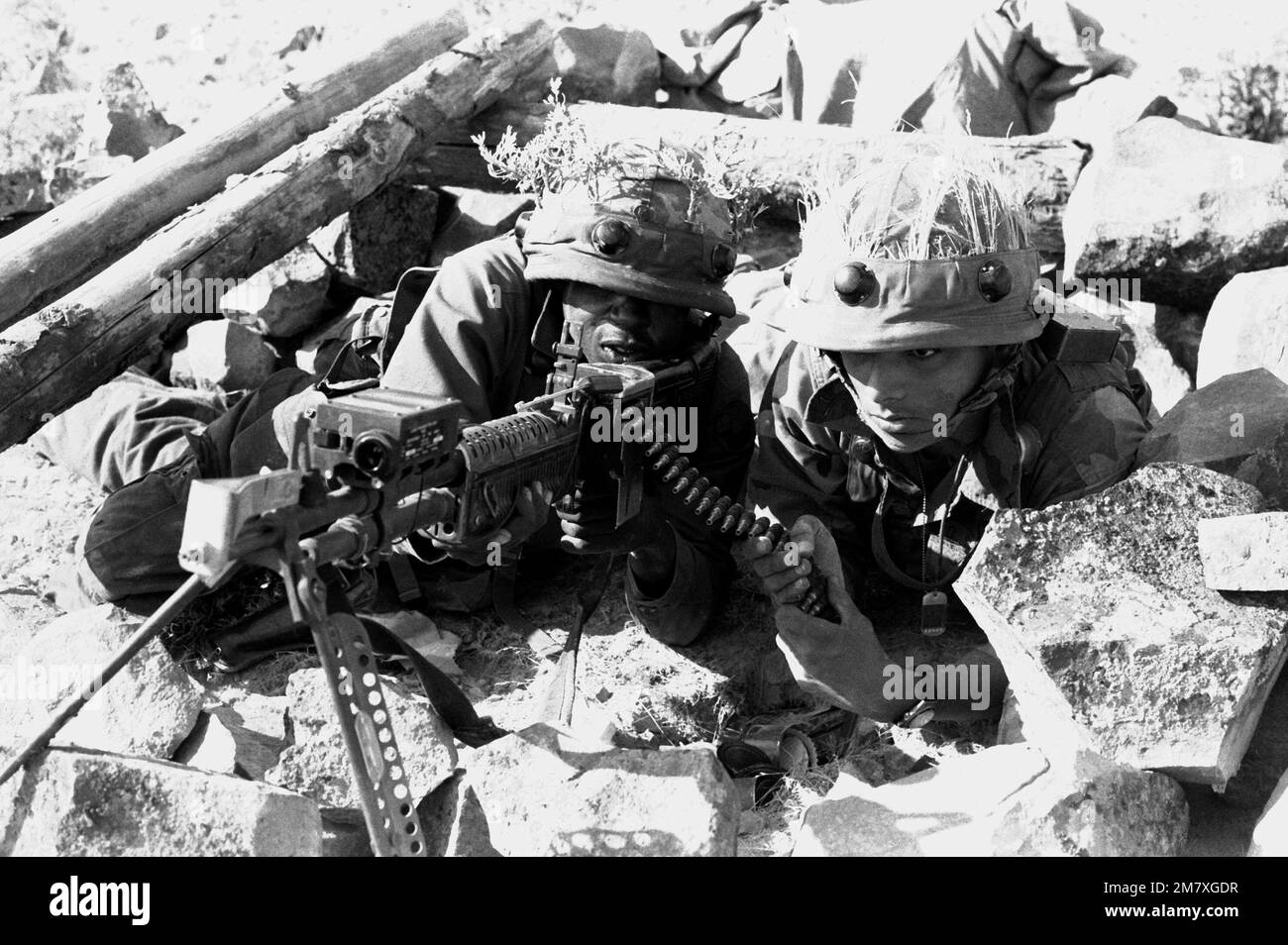 Members of a machine gun team from Co. C, 2nd Bn., 2nd Inf., man ...