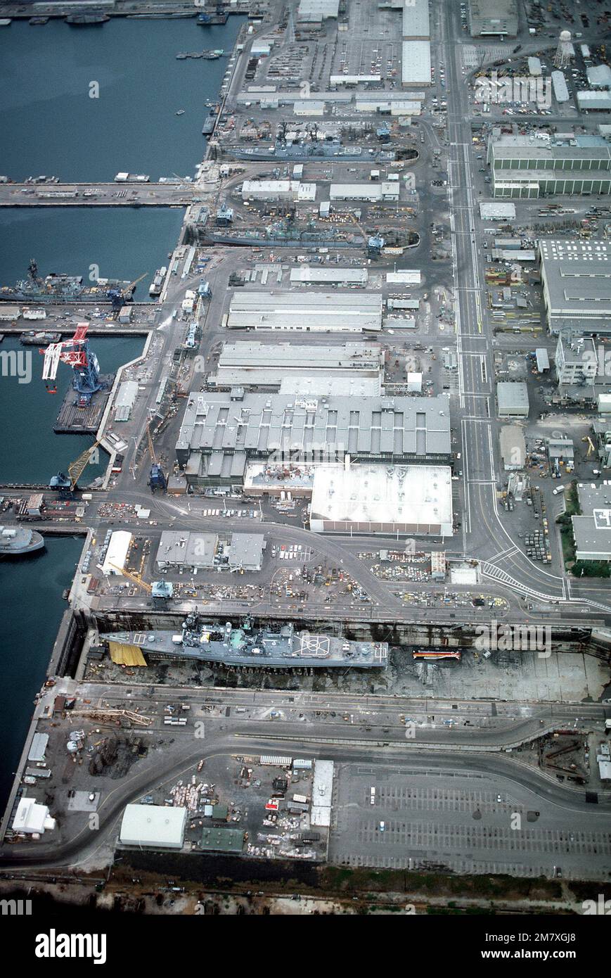 Aerial view of the dry dock area. The battleship NEW JERSEY (BB-62) has ...