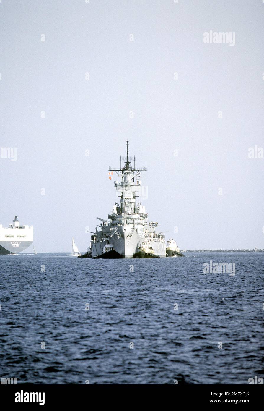 Bow view of the battleship USS NEW JERSEY (BB-62) being towed into the ...
