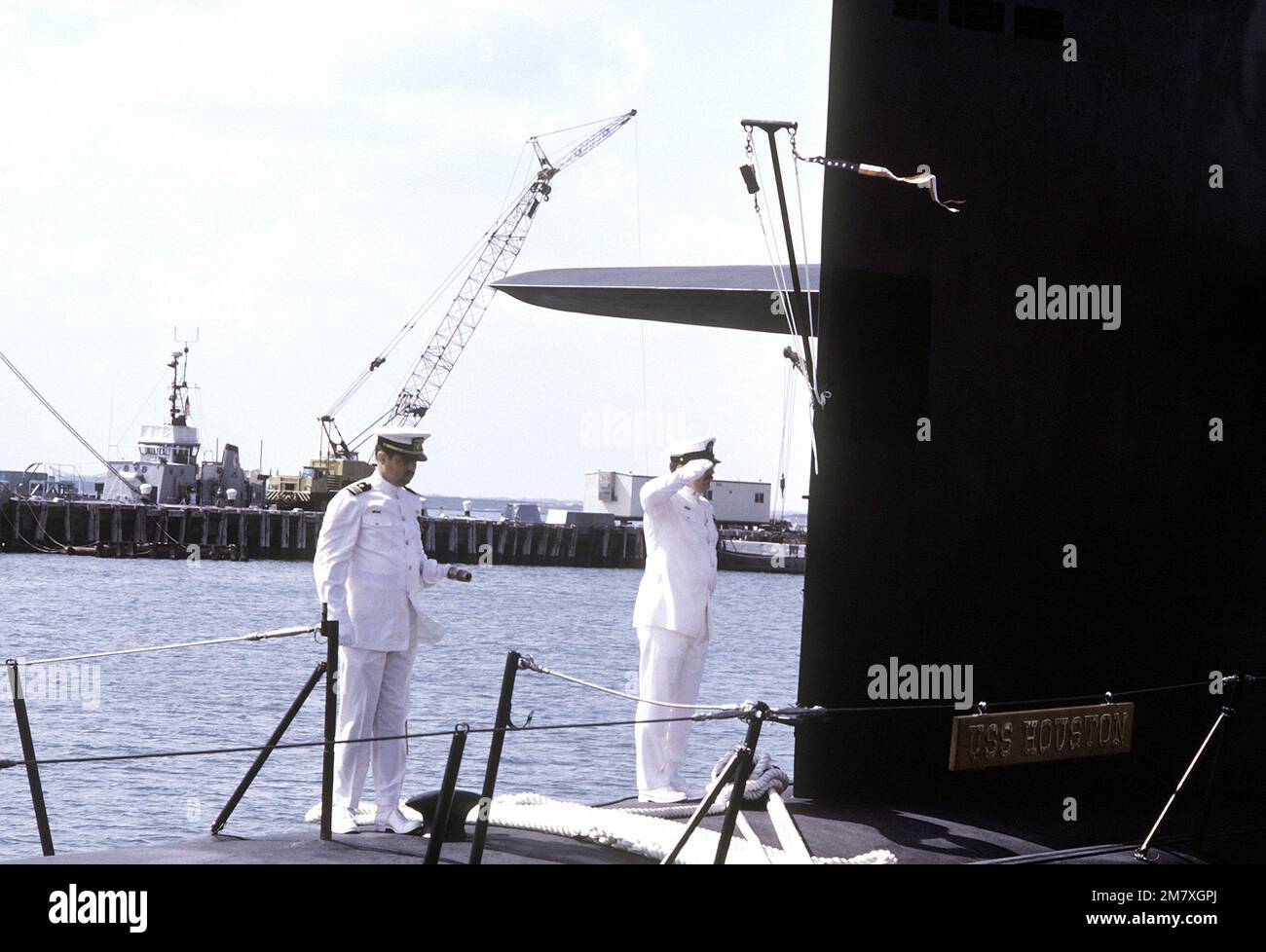 The commissioning pennant is saluted during the commissioning ceremony ...