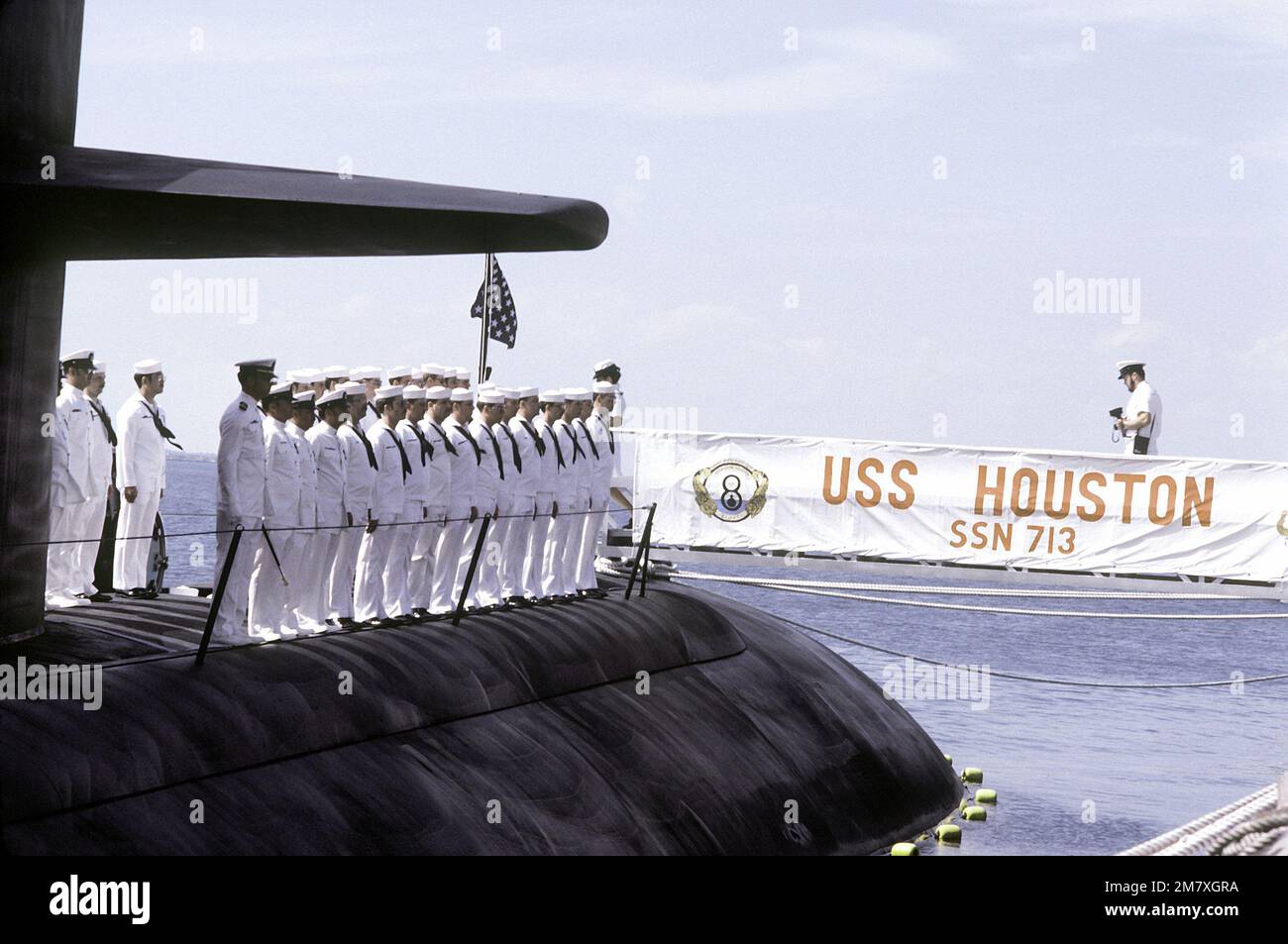 Right side view of the ship's company as they stand in formation during ...