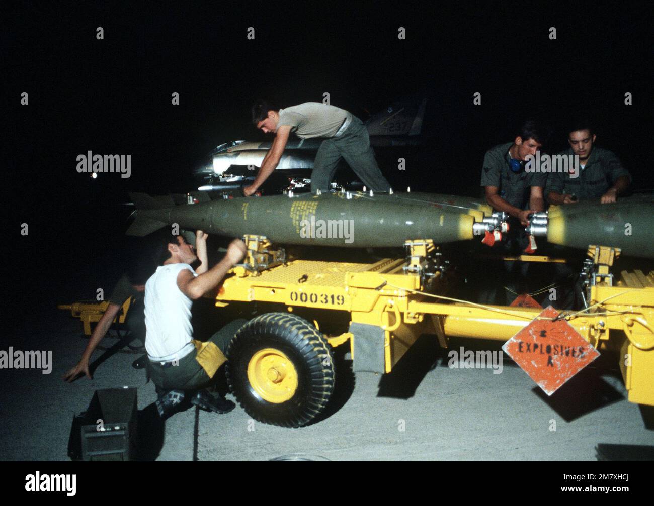Members of the 3rd Munitions Maintenance Squadron prepare to load Mark ...